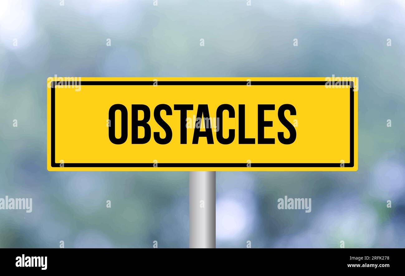 Obstacles road sign on blur background Stock Photo - Alamy