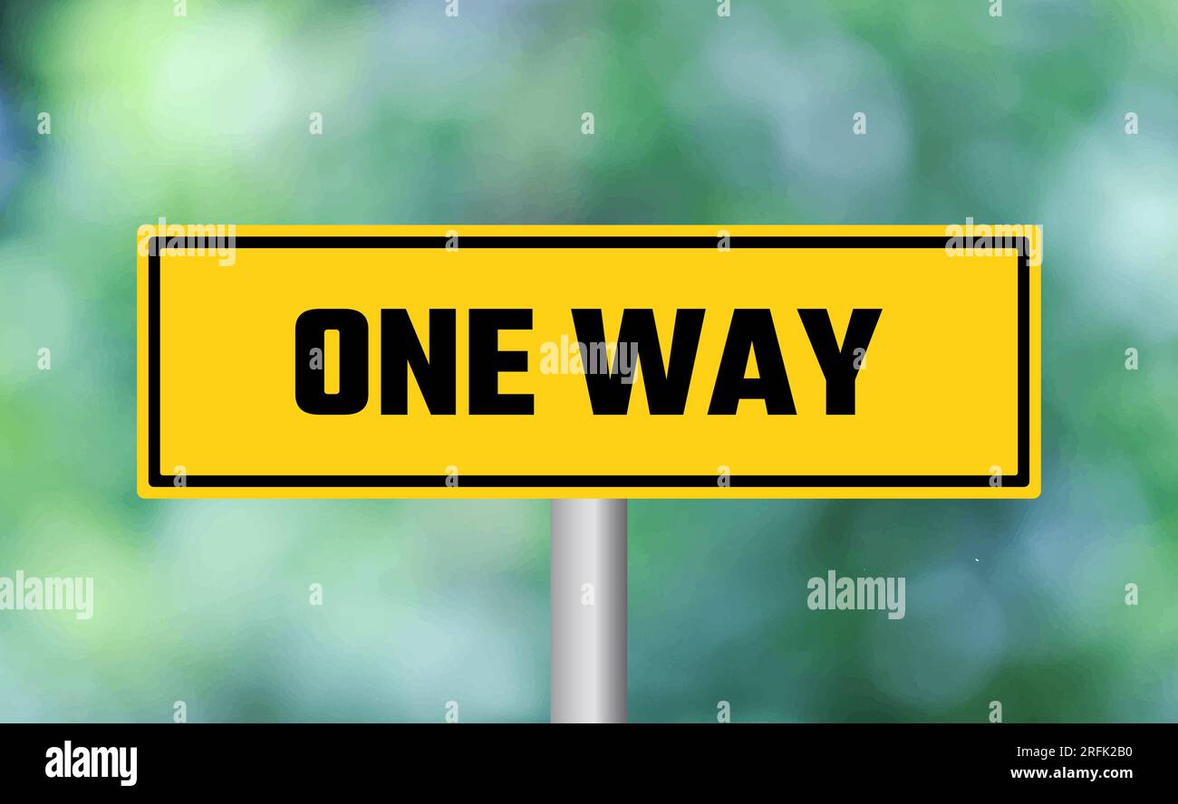 One way road sign on blur background Stock Photo - Alamy