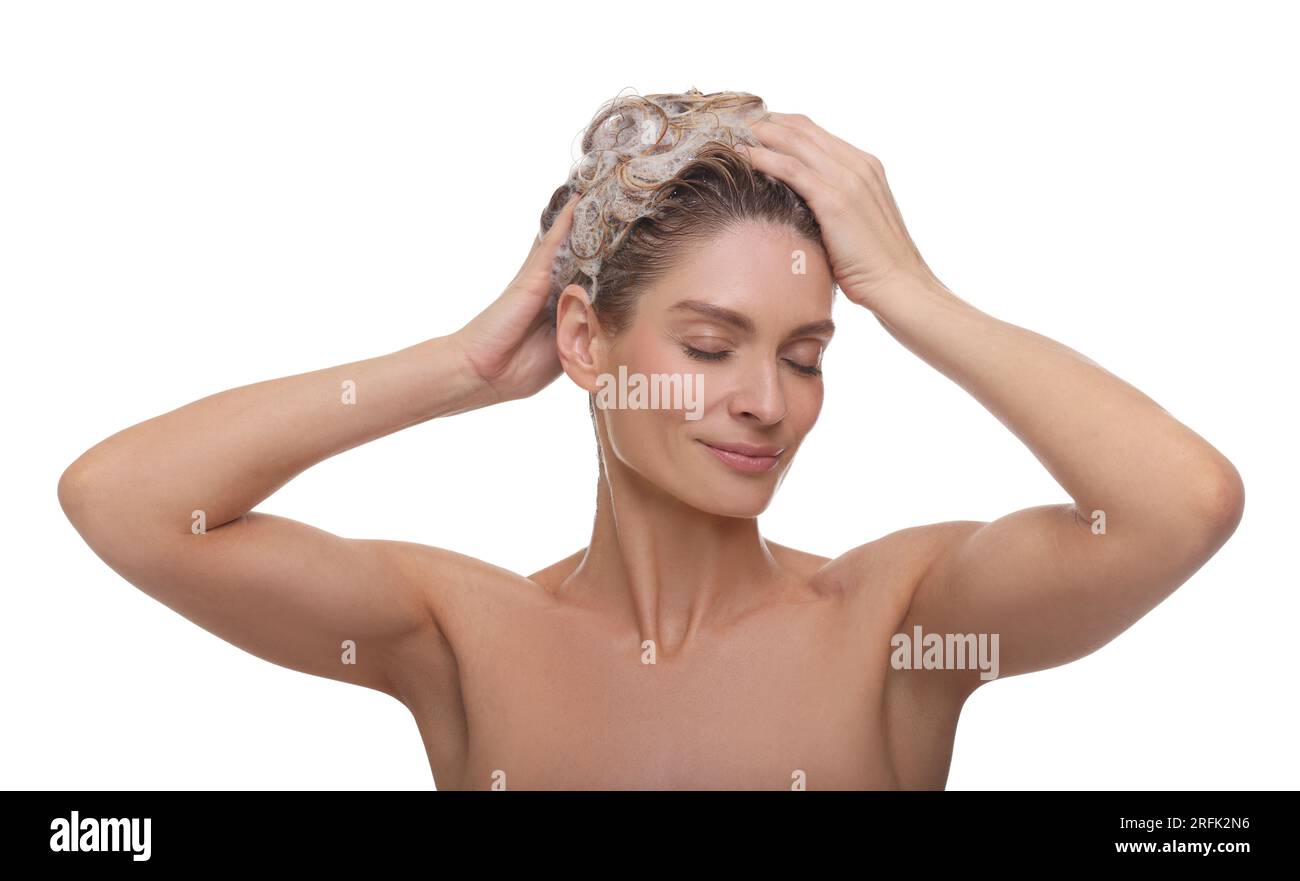 Beautiful woman washing hair on white background Stock Photo - Alamy