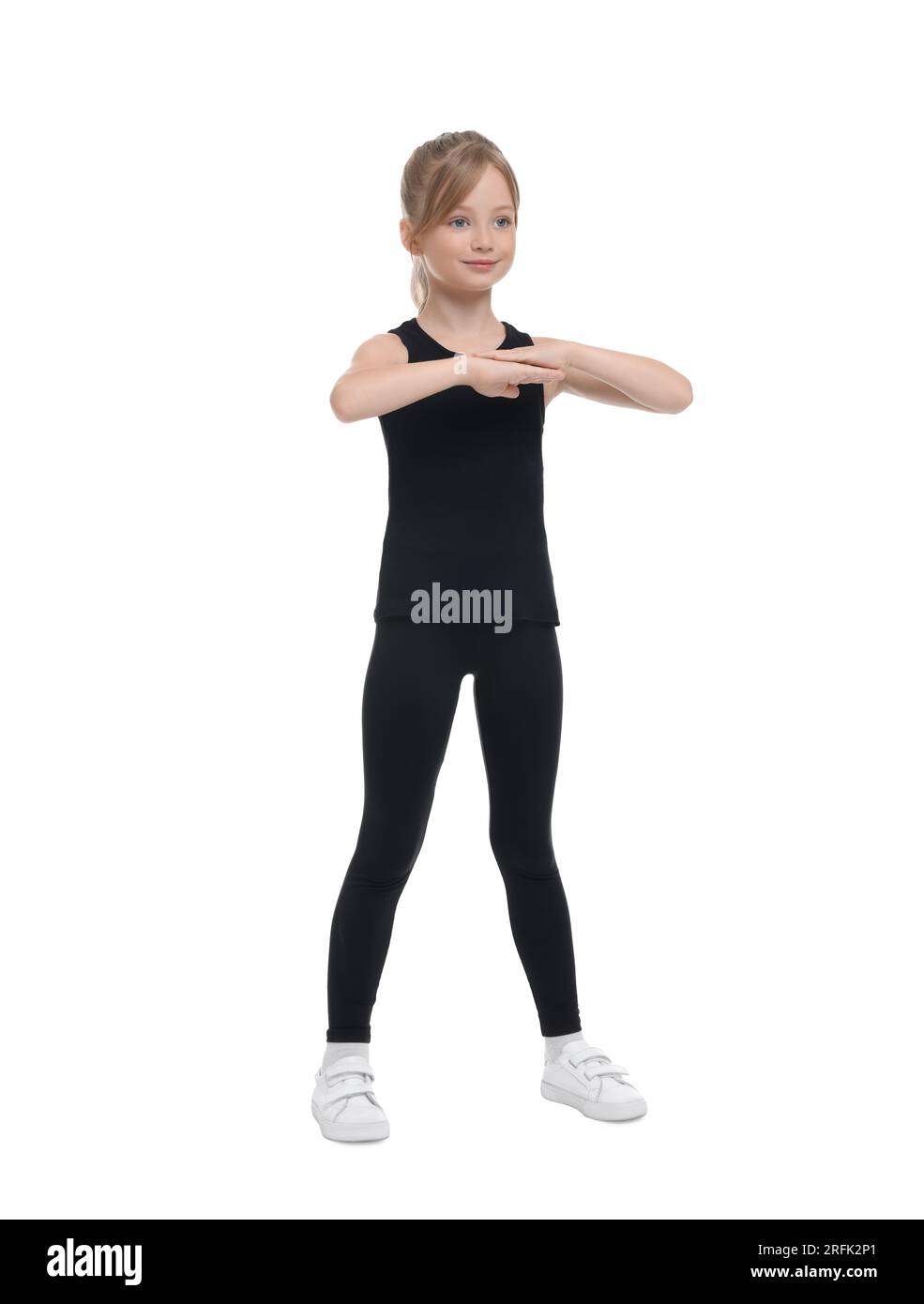 Little girl doing morning exercise on white background Stock Photo - Alamy