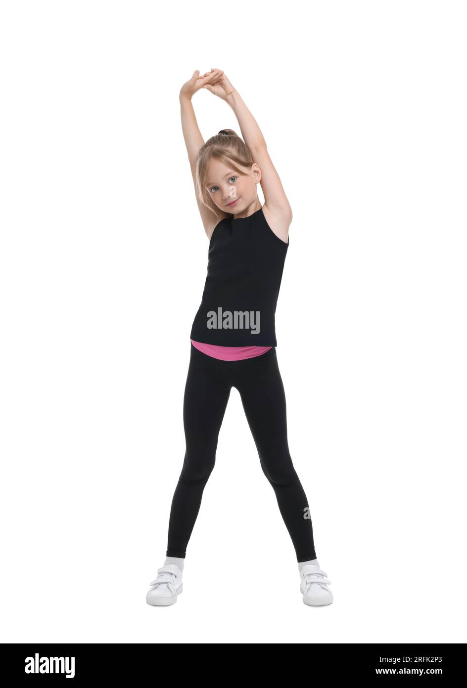 Little girl doing morning exercise on white background Stock Photo - Alamy