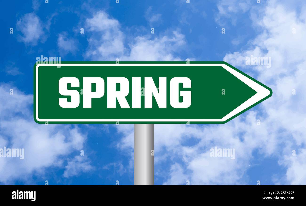 Spring road sign on cloudy sky background Stock Photo - Alamy