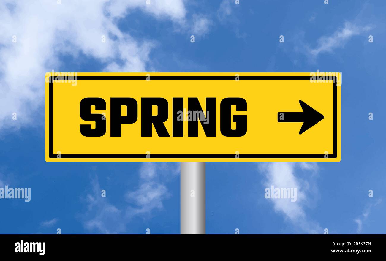 Spring road sign on cloudy sky background Stock Photo - Alamy
