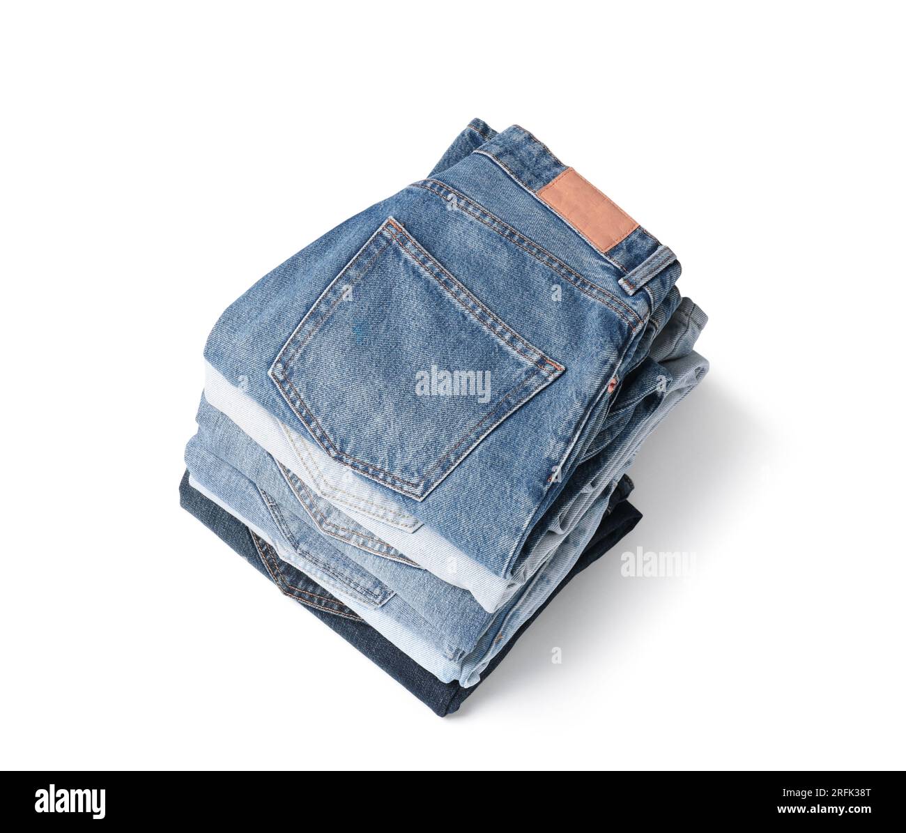 Stack of different folded jeans isolated on white Stock Photo - Alamy