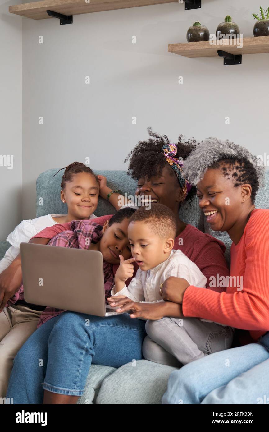 African horizontal extended family having a good time in front of the ...