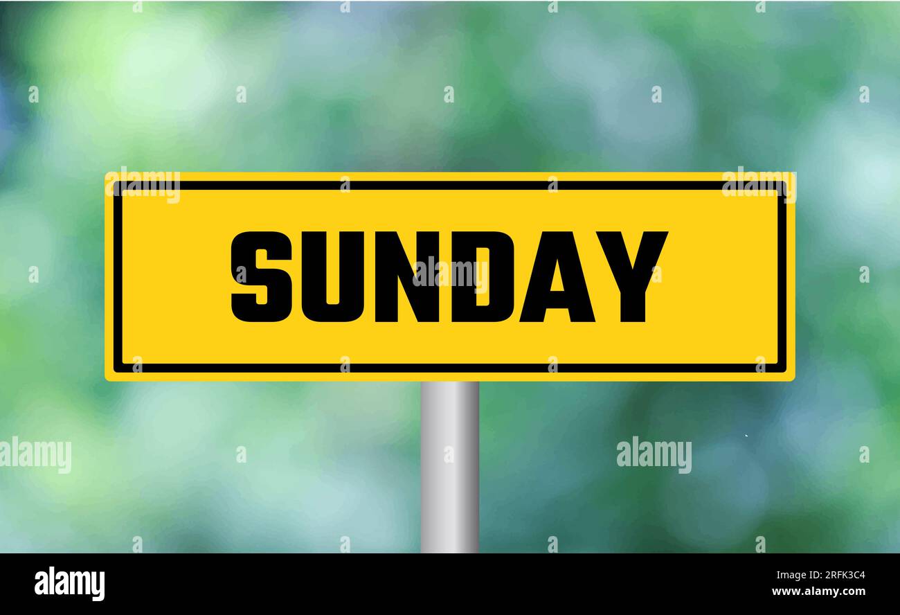 Sunday road sign on blur background Stock Photo - Alamy