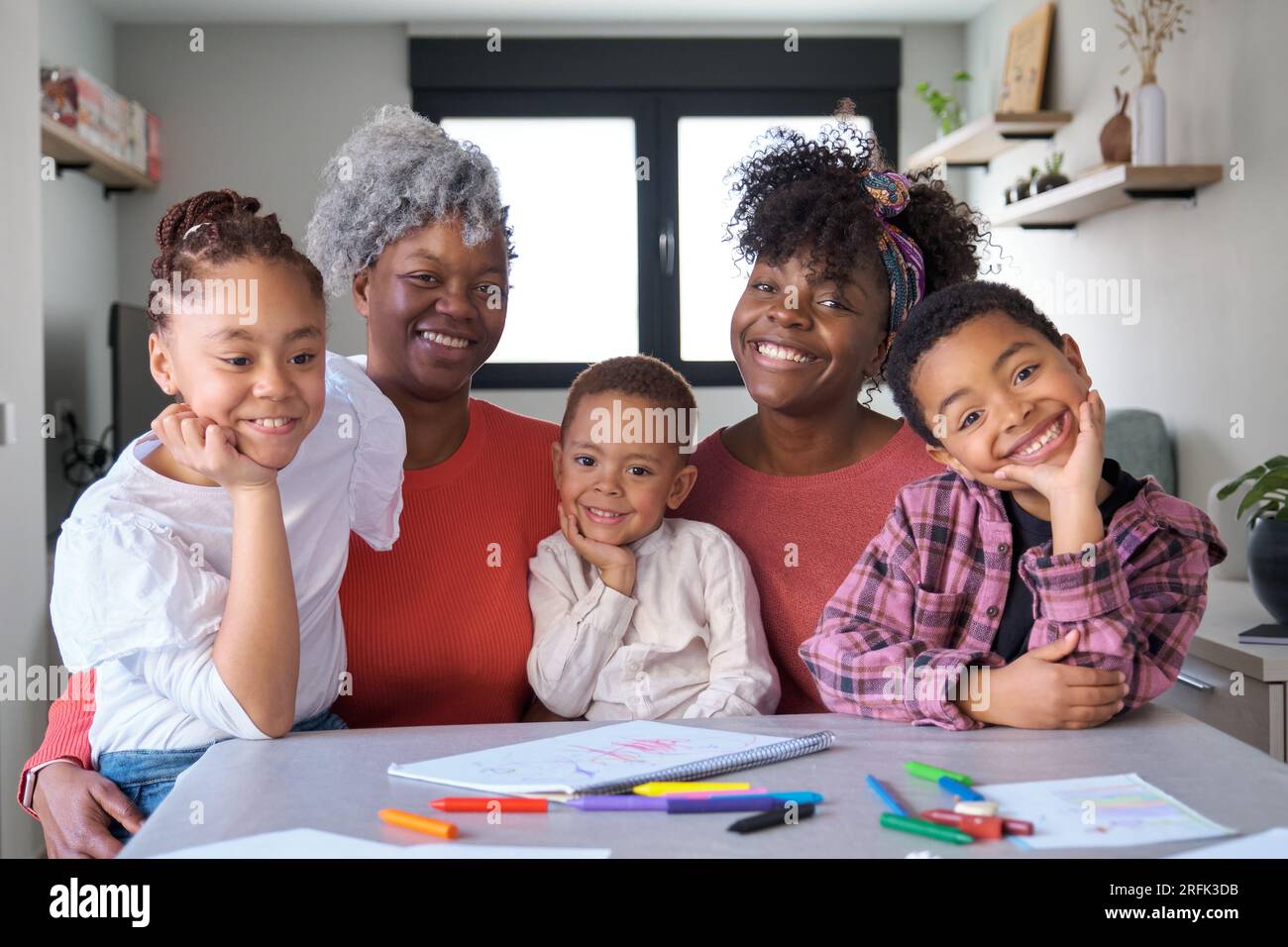 African horizontal extended family looking at camera and smiling at ...