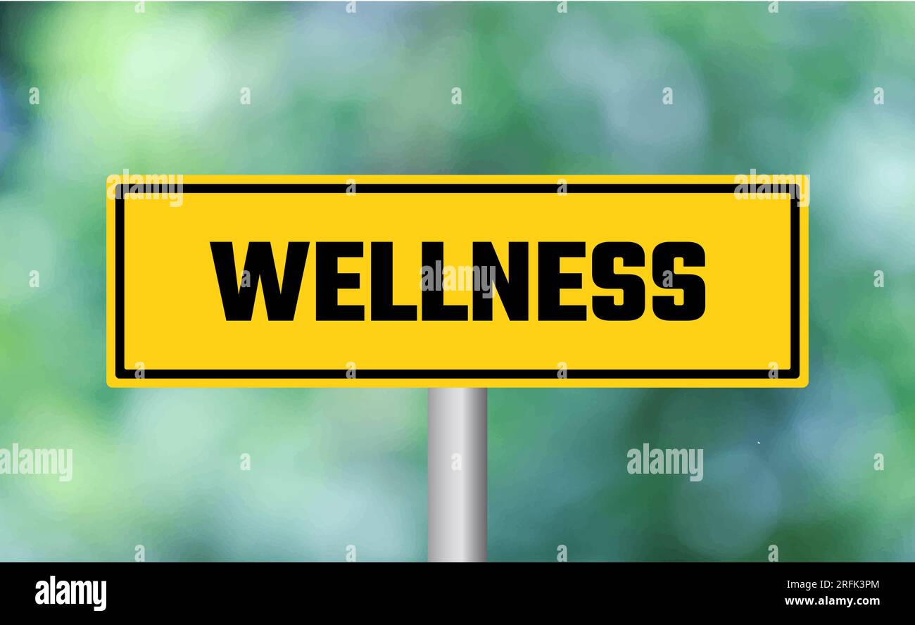 Wellness road sign on blur background Stock Photo - Alamy