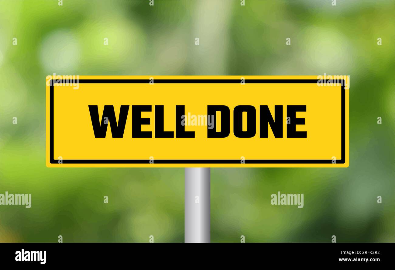 Well done road sign on blur background Stock Photo - Alamy