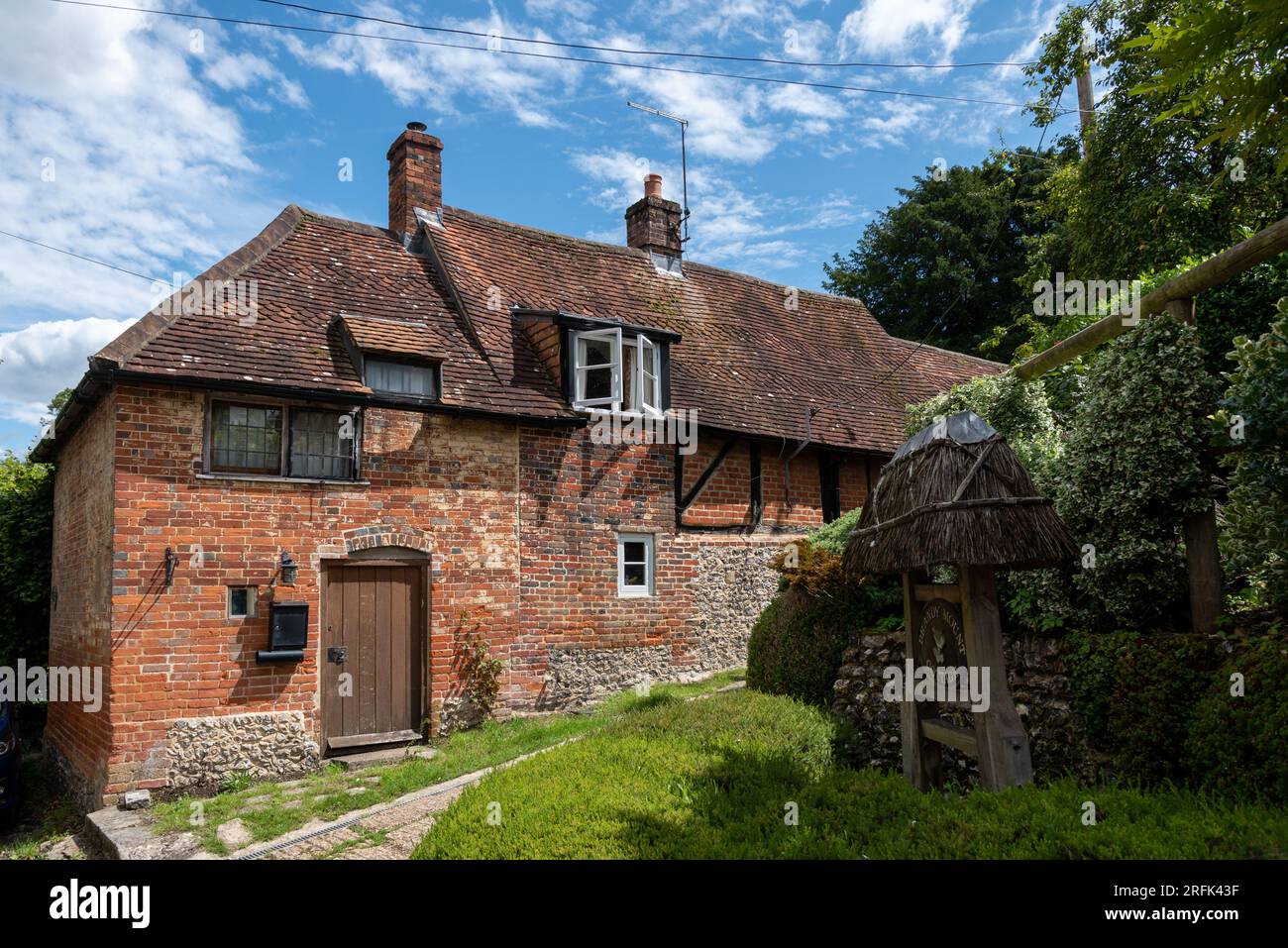 Brick houses and a small lane in the English countryside village of ...