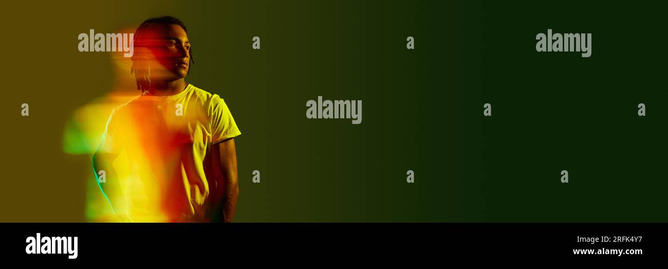 Inner self. Creative portrait of handsome young guy with neon filter ...