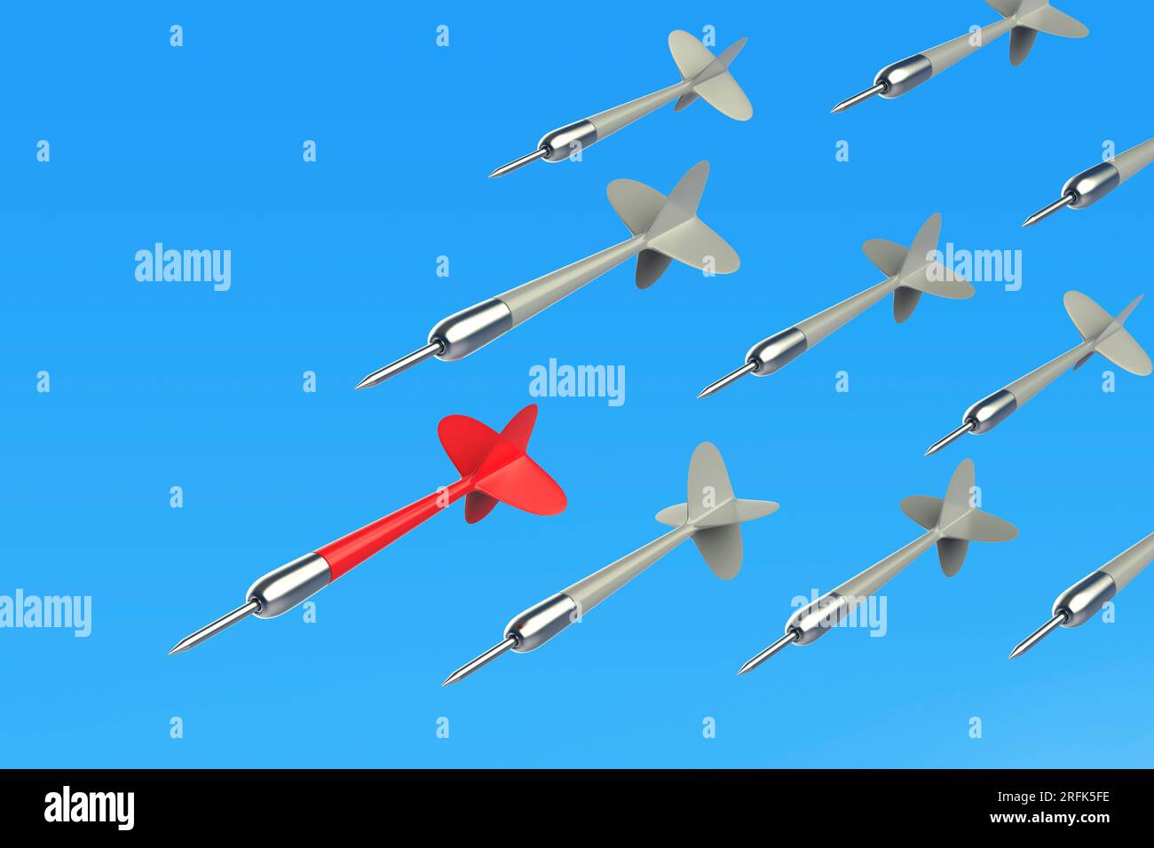 Concept image with many flying darts against blue sky, red dart on the ...