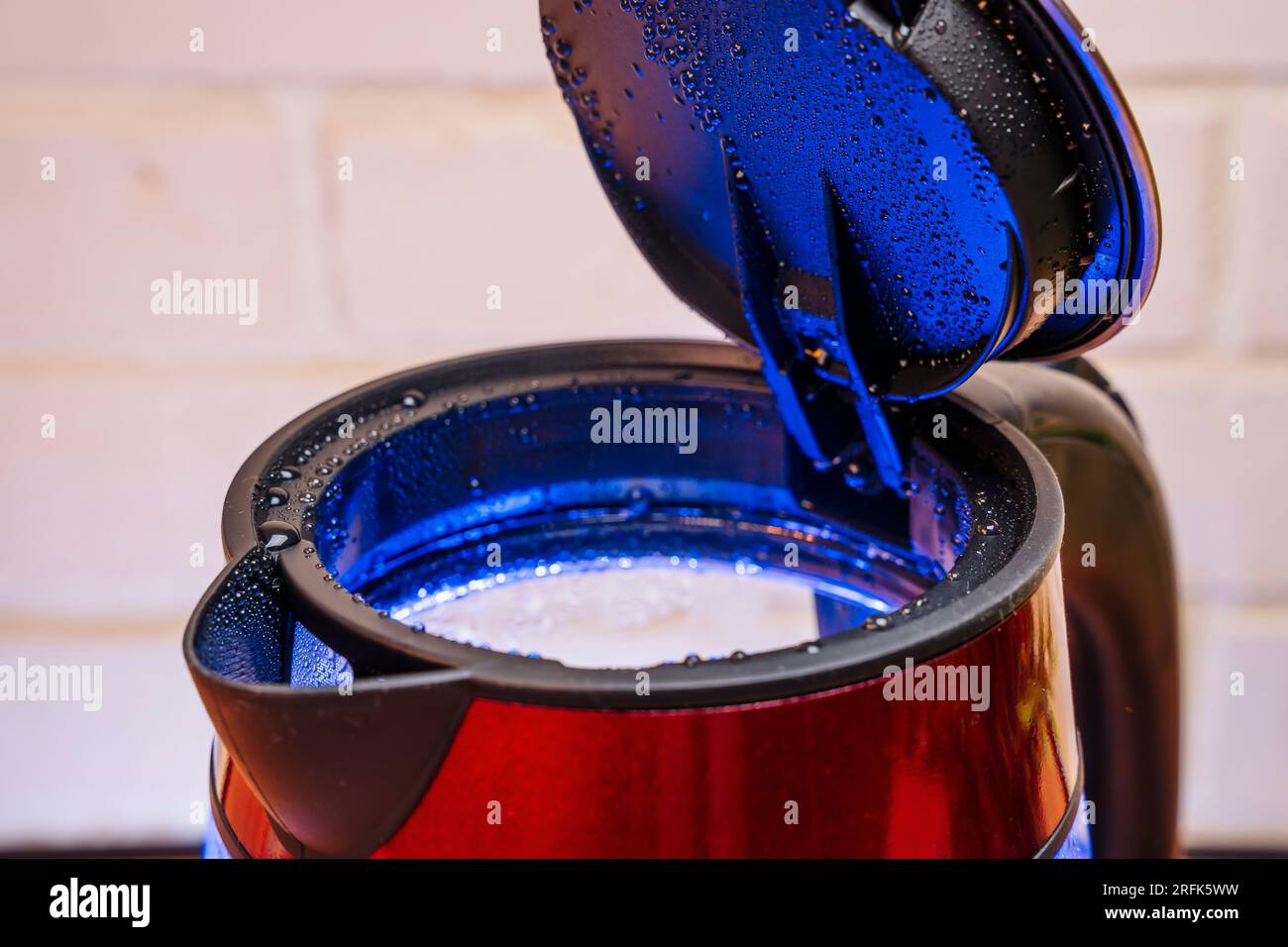 Close - up of an open lid of an electric kettle covered with large ...