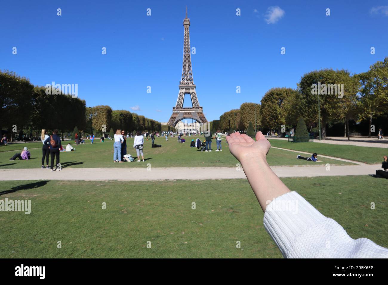 Eiffel Tower, Paris. Womans hand pointing at Eiffel Tower. Image ...