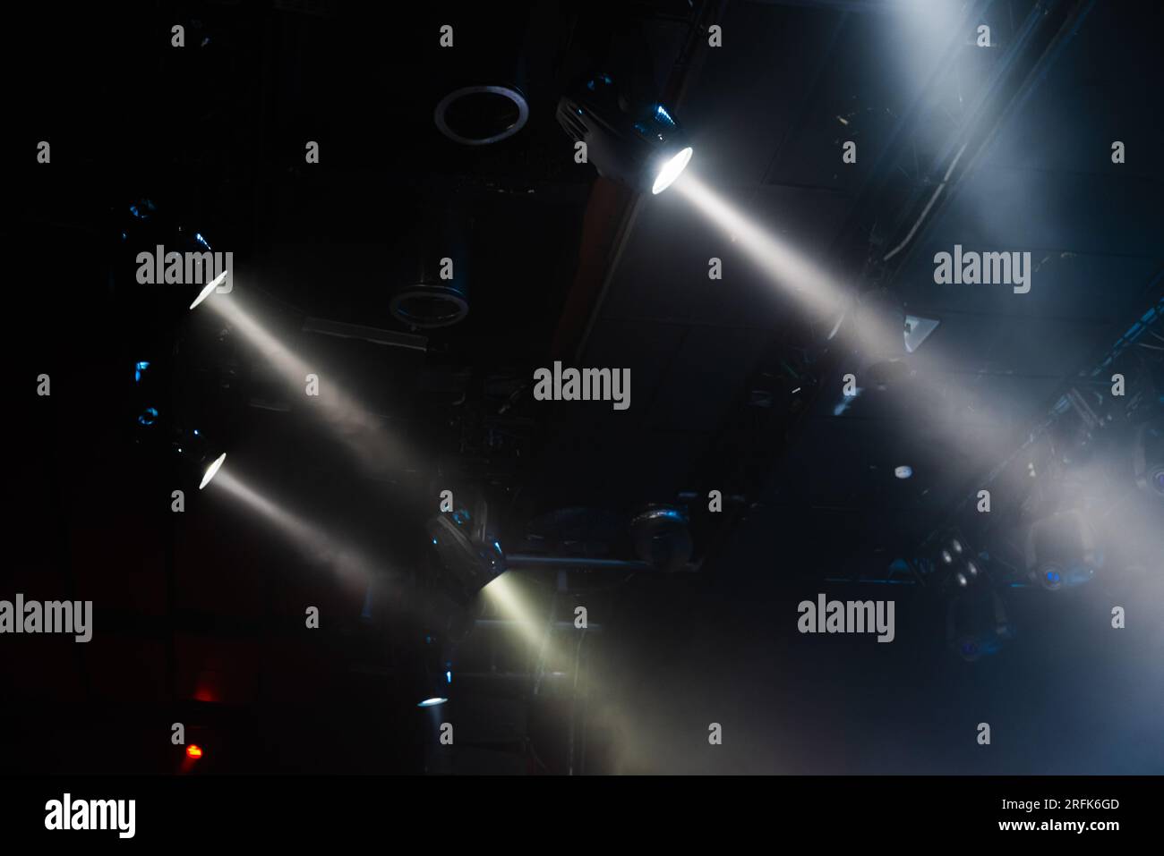 Beams of stage spotlights in smoke over dark background, modern stage ...