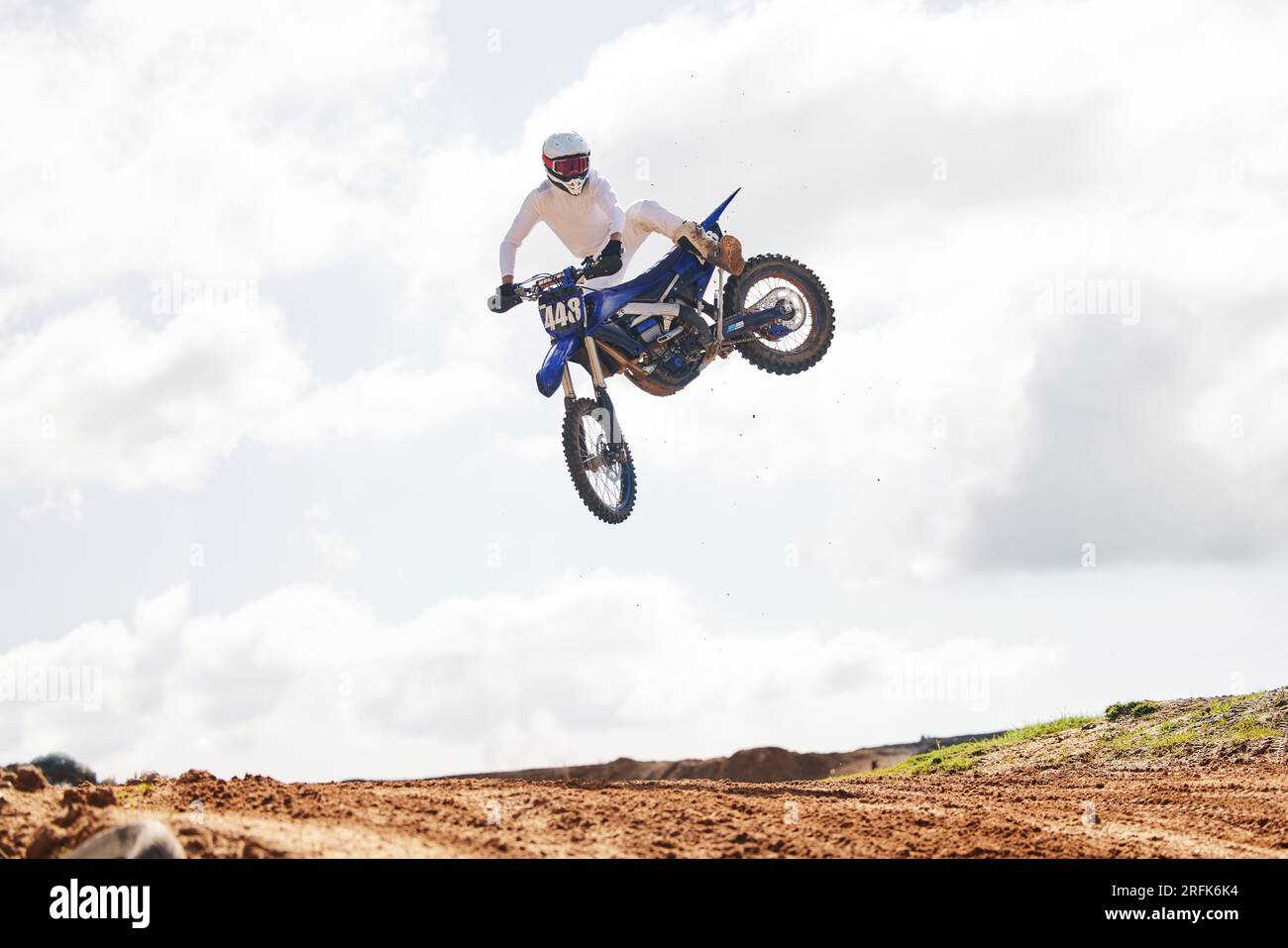 Sports, jump and man on motorcycle with freedom, energy and power stunt ...