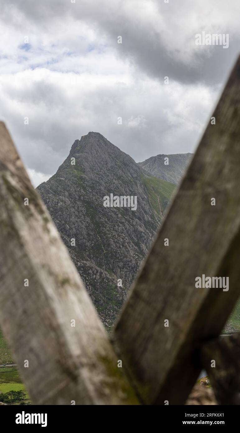 View of pyramid shaped mountain with blurred gate in foreground Stock ...
