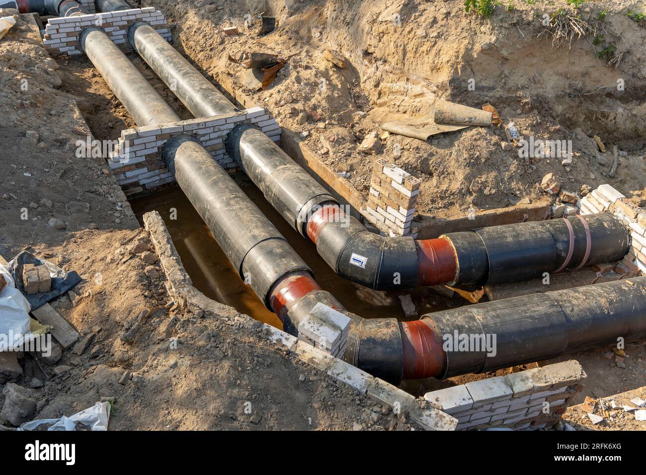 underground trench laying of new pipes in the city water supply and ...