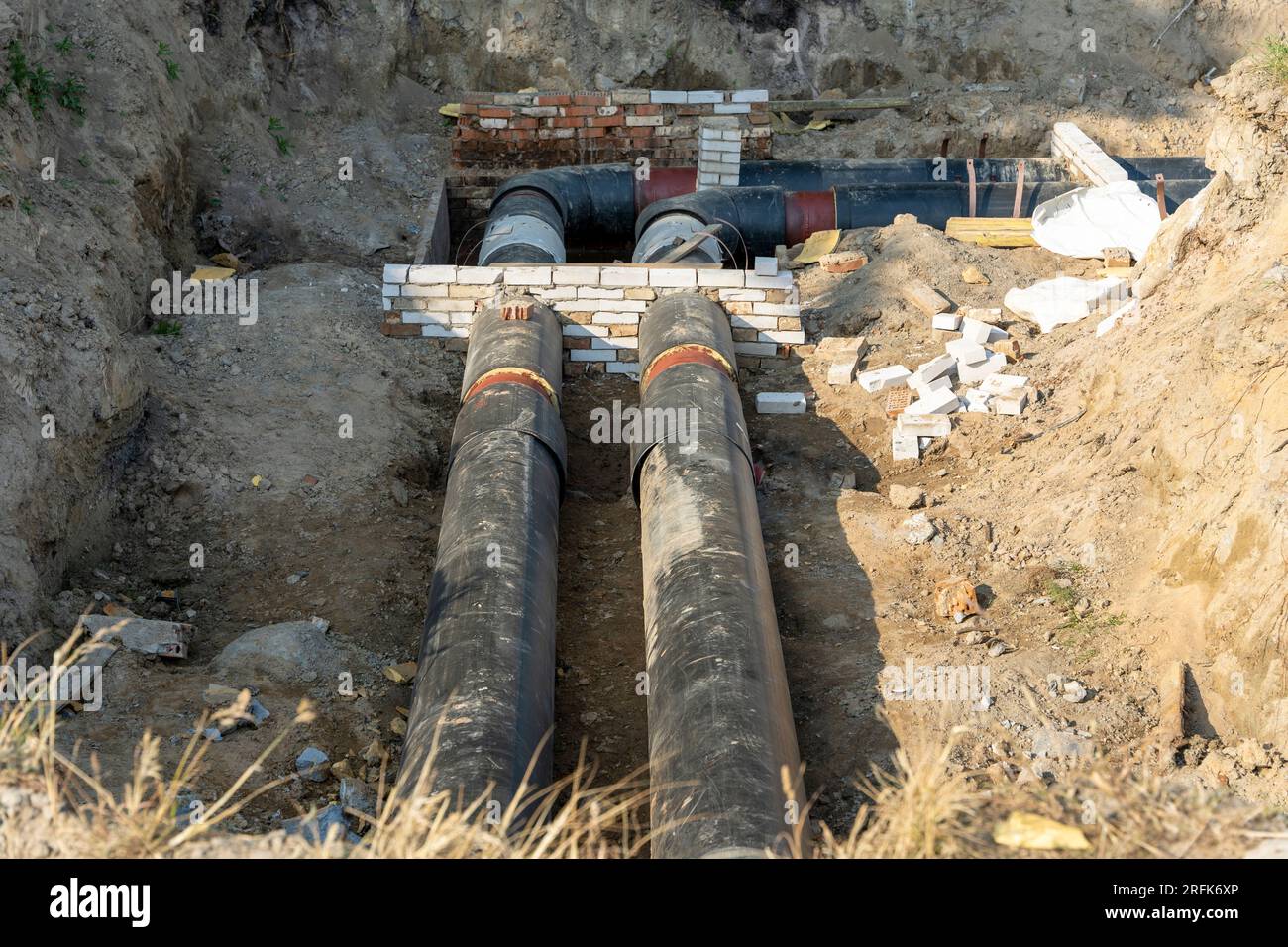 underground trench laying of new pipes in the city water supply and ...