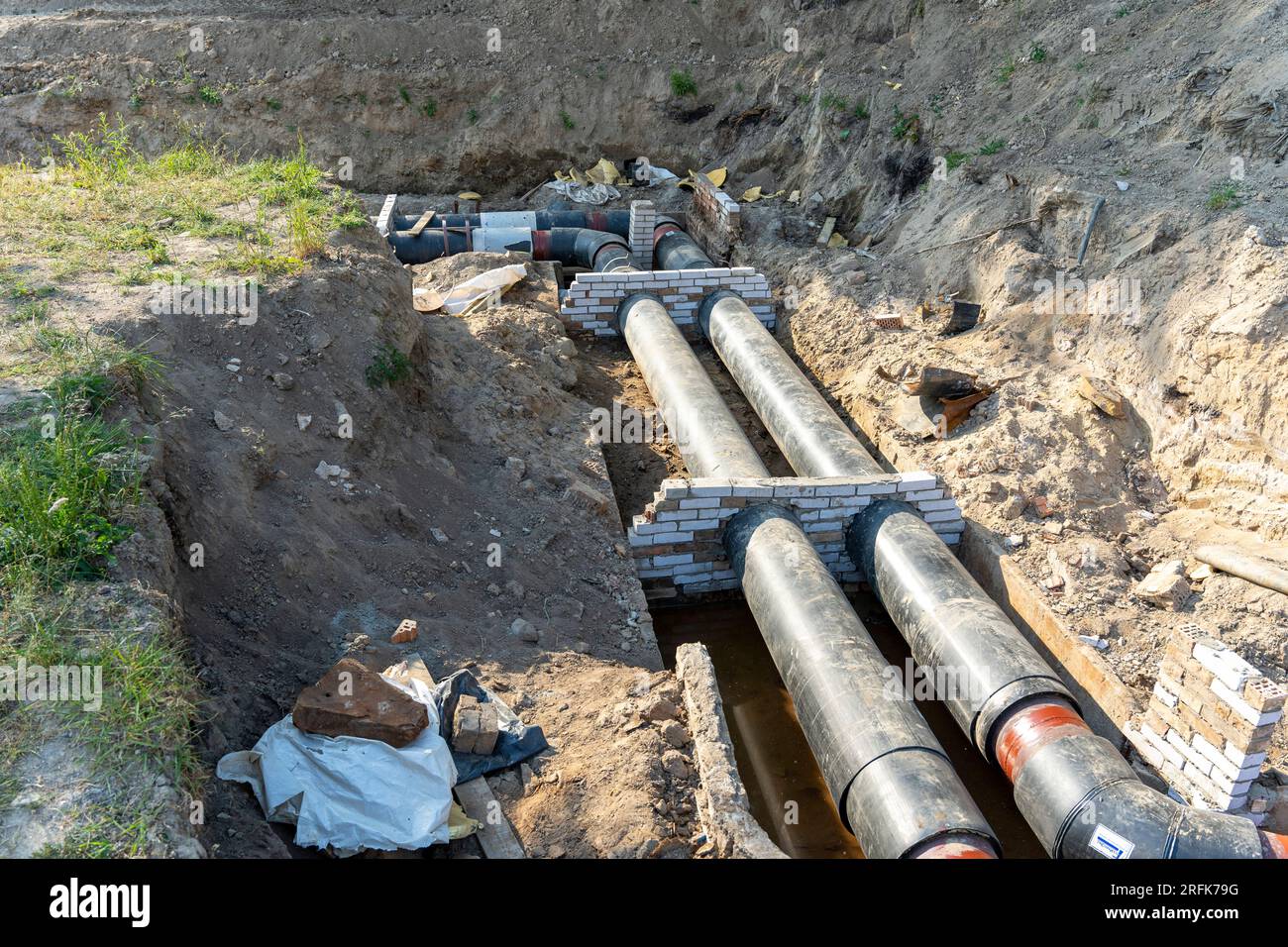 underground trench laying of new pipes in the city water supply and ...