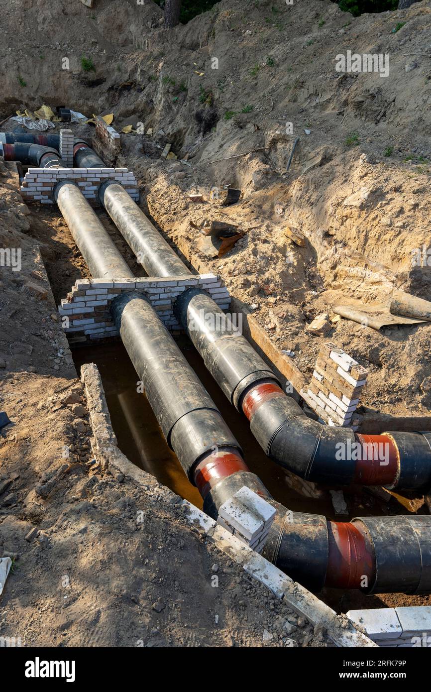 underground trench laying of new pipes in the city water supply and ...