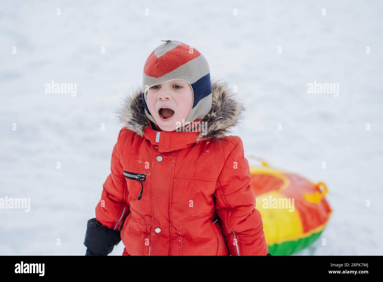 Happy Cute Caucasian Boy With Snow Tubing In Winter Park Winter Happy Cute Caucasian Boy With Snow Tubing In Winter Park Winter