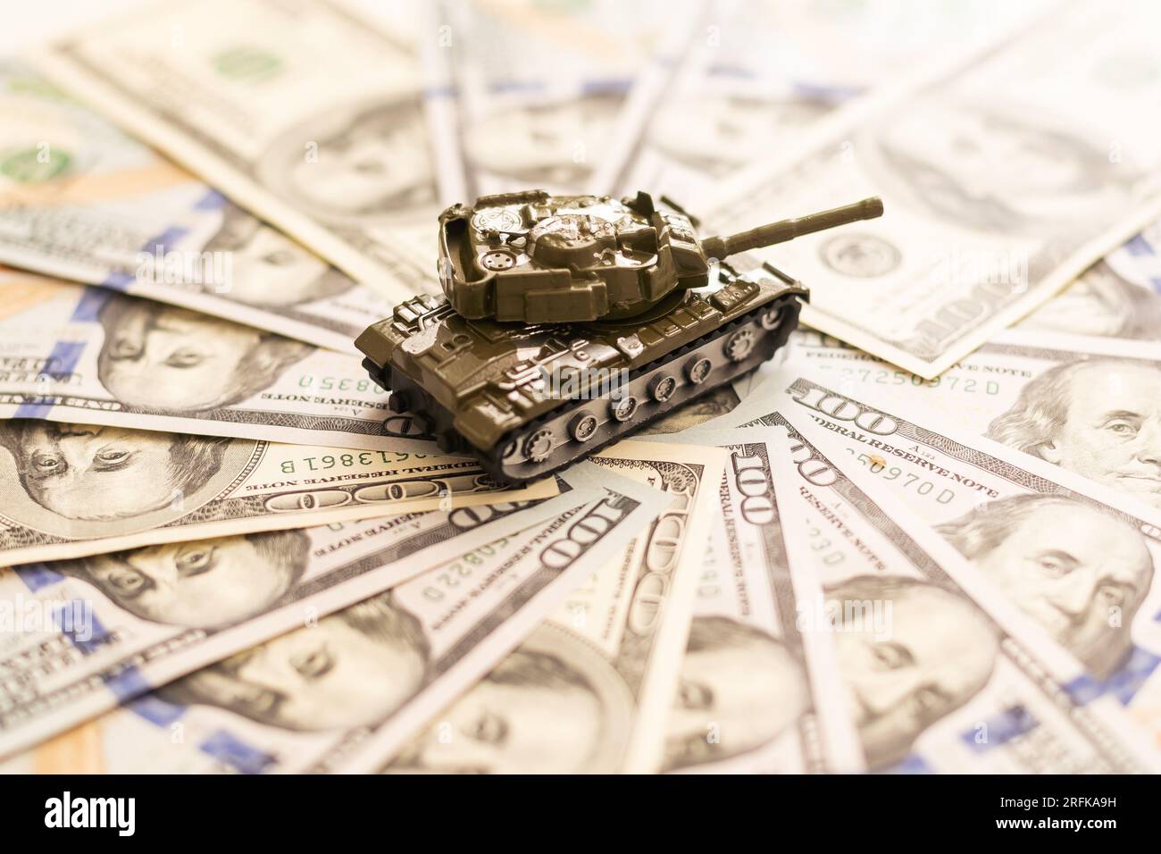 tank against the background of dollars. Concept of war Stock Photo - Alamy