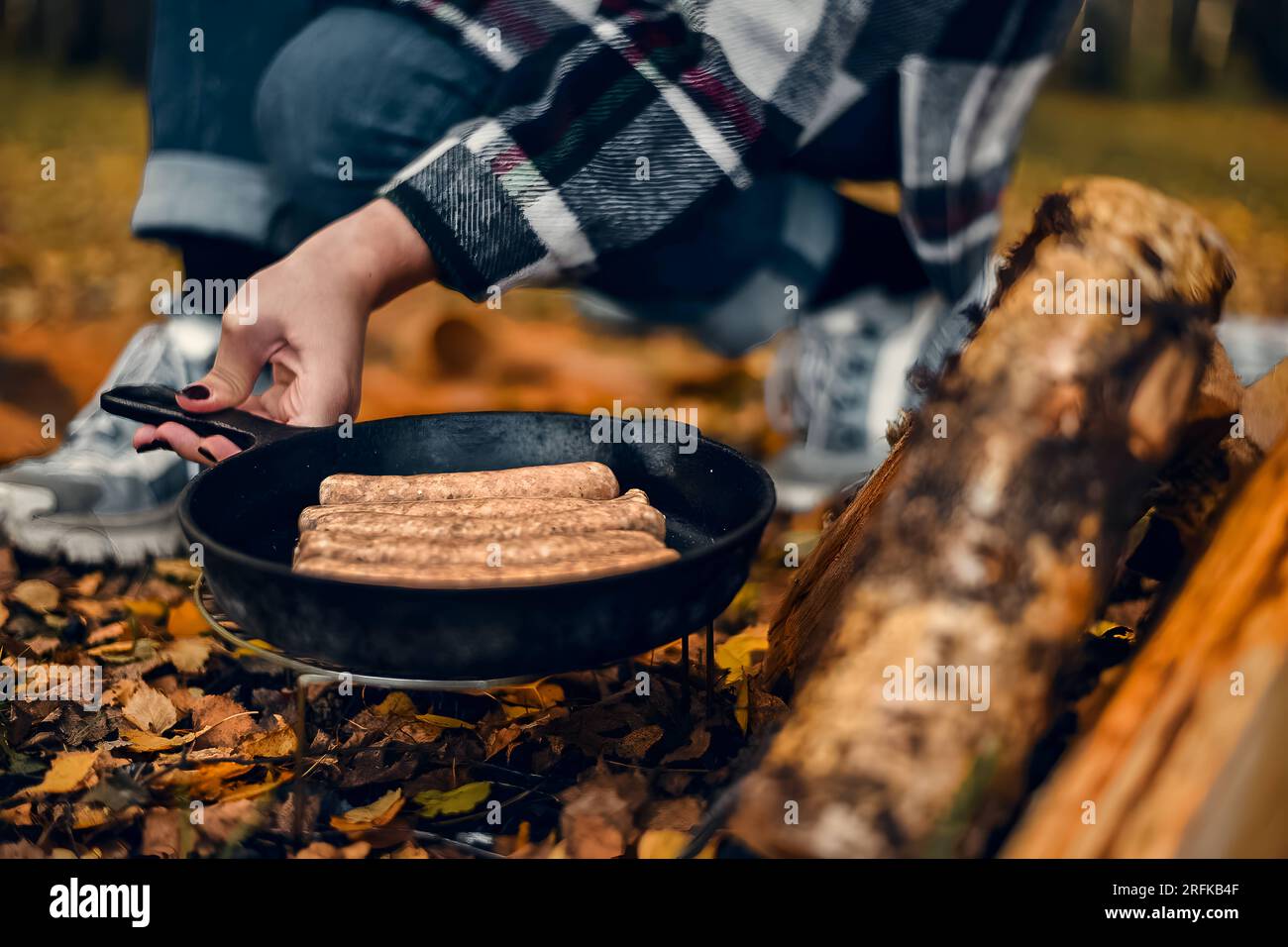 fried bacon in a pan over a campfire in the forest Stock Photo - Alamy