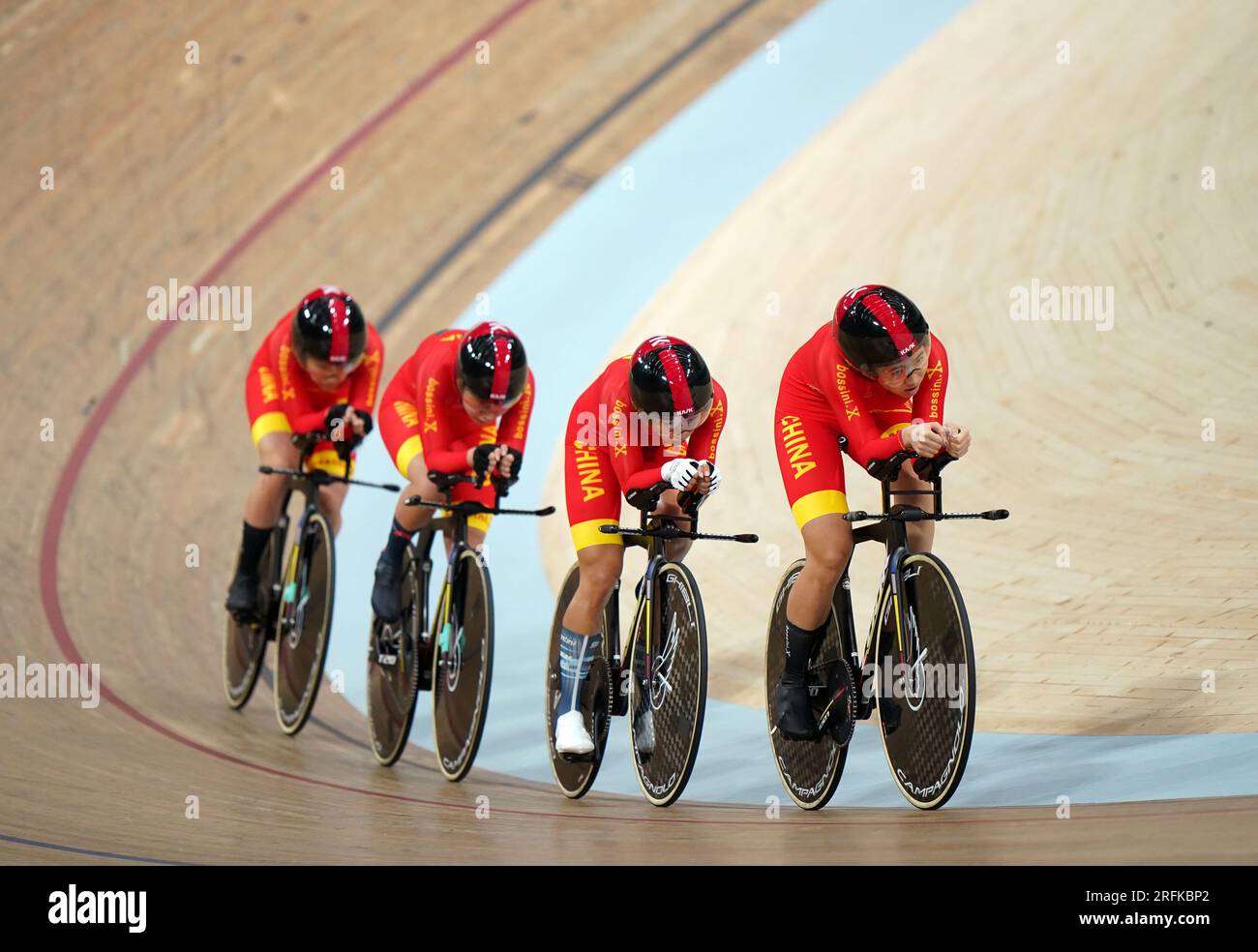 China's Hongjie Zhang (right) leads her group in the Women's Elite Team ...