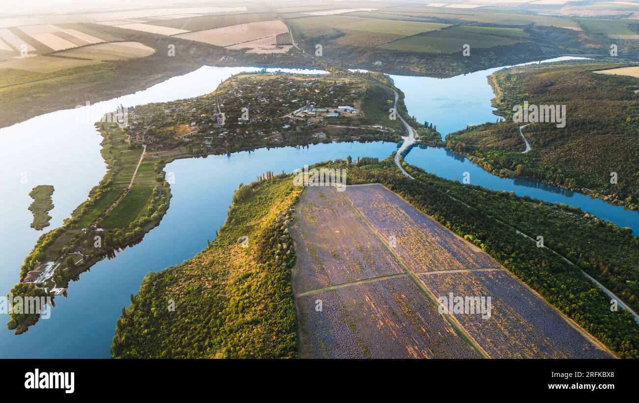 Aerial drone view of nature in Moldova. Dniester river with village on ...