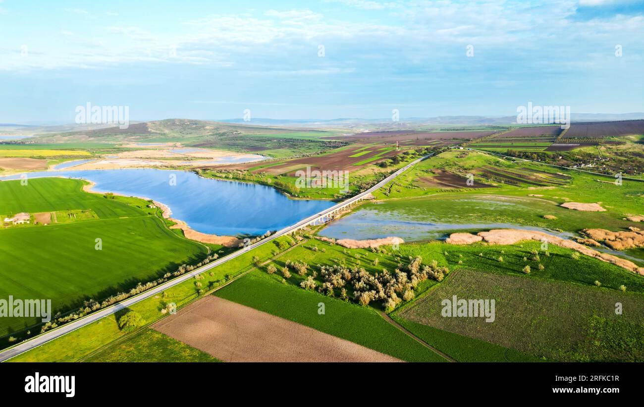 Aerial drone view of nature in Moldova. River with a highway above ...