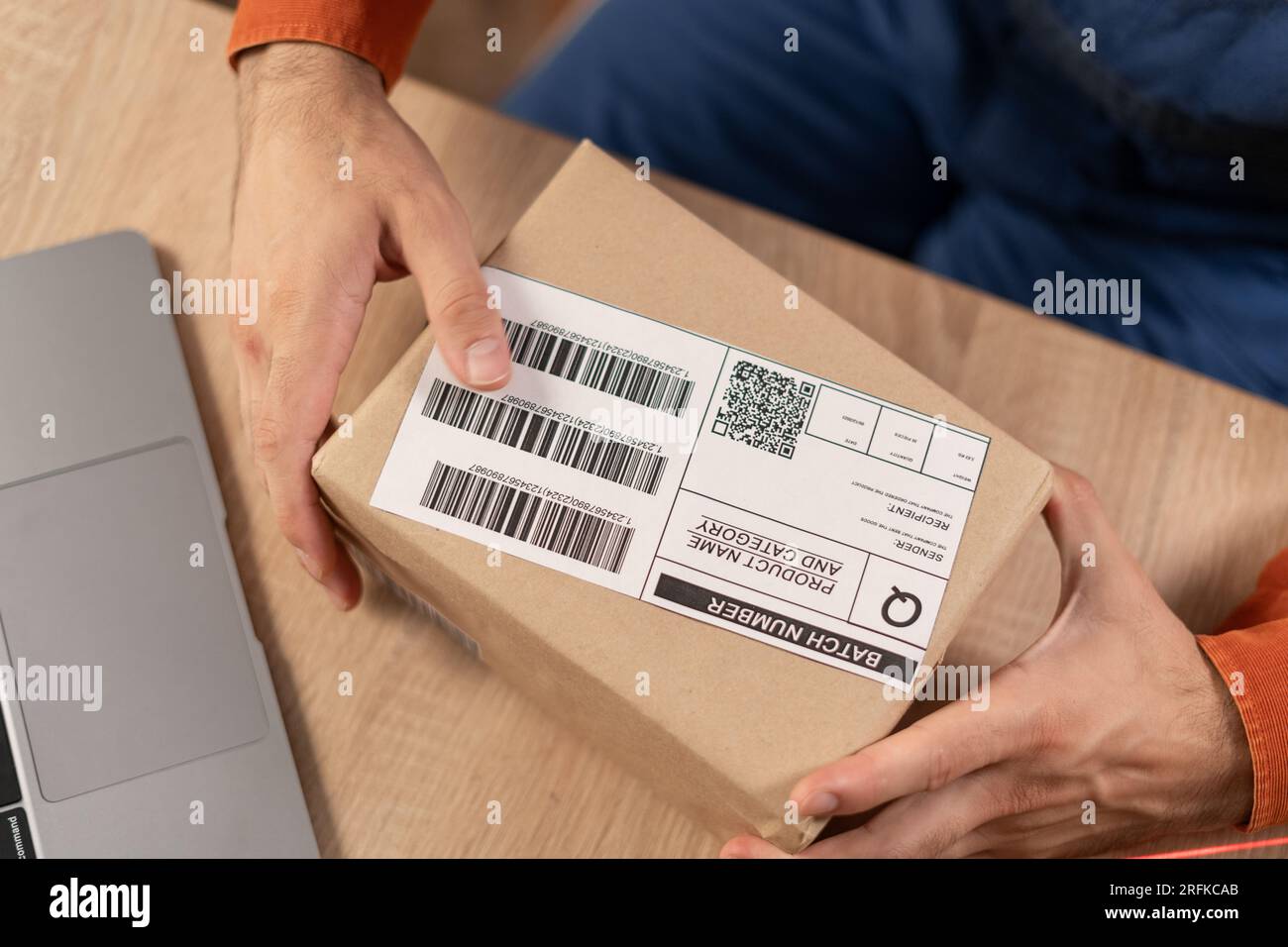 Male entrepreneurs packing product shipping order box for dispatching ...