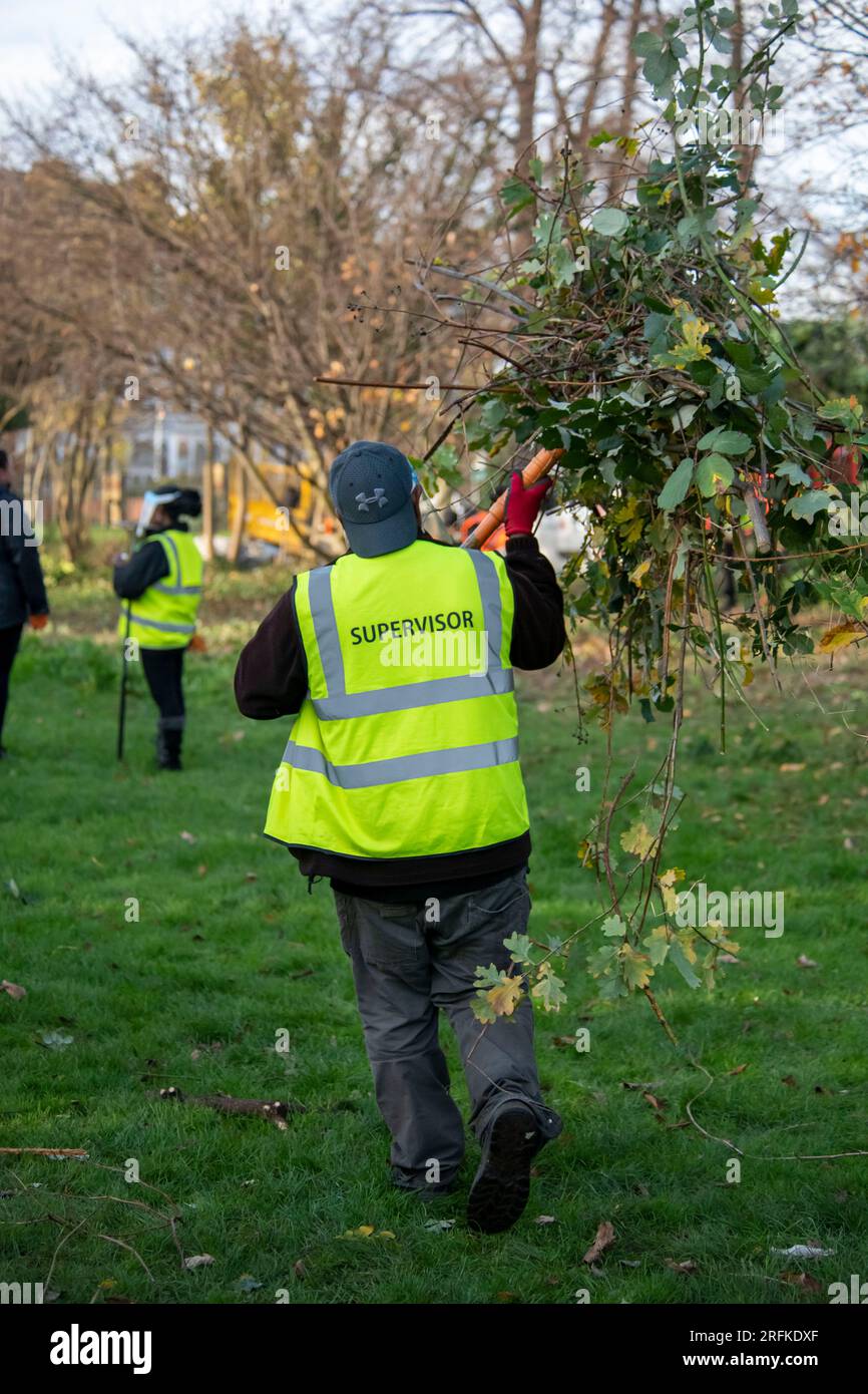 Community Payback cleaning and clearing an outdoor space, here a ...