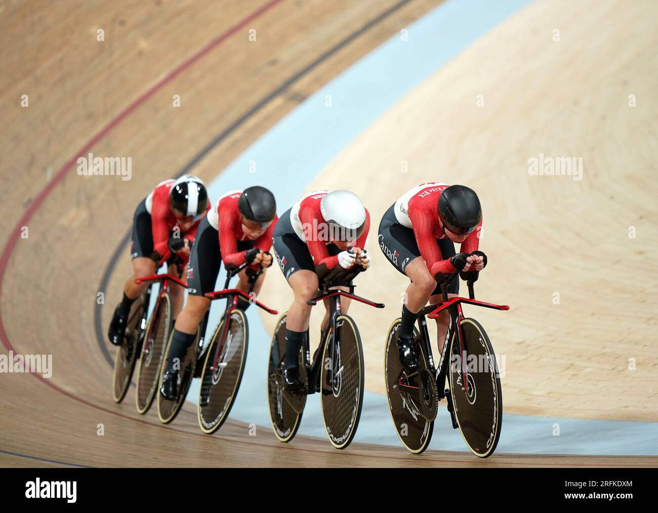 Canada's Erin Attwell (right) leads her group in the Women's Elite Team ...