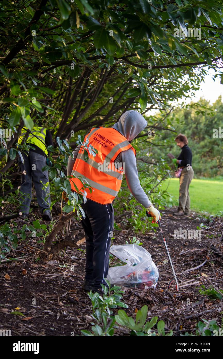 Plastic bags full of rubbish are removed from the grounds of a sports ...