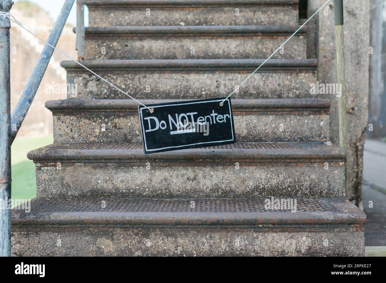 do not enter sign on cement staircase Stock Photo - Alamy