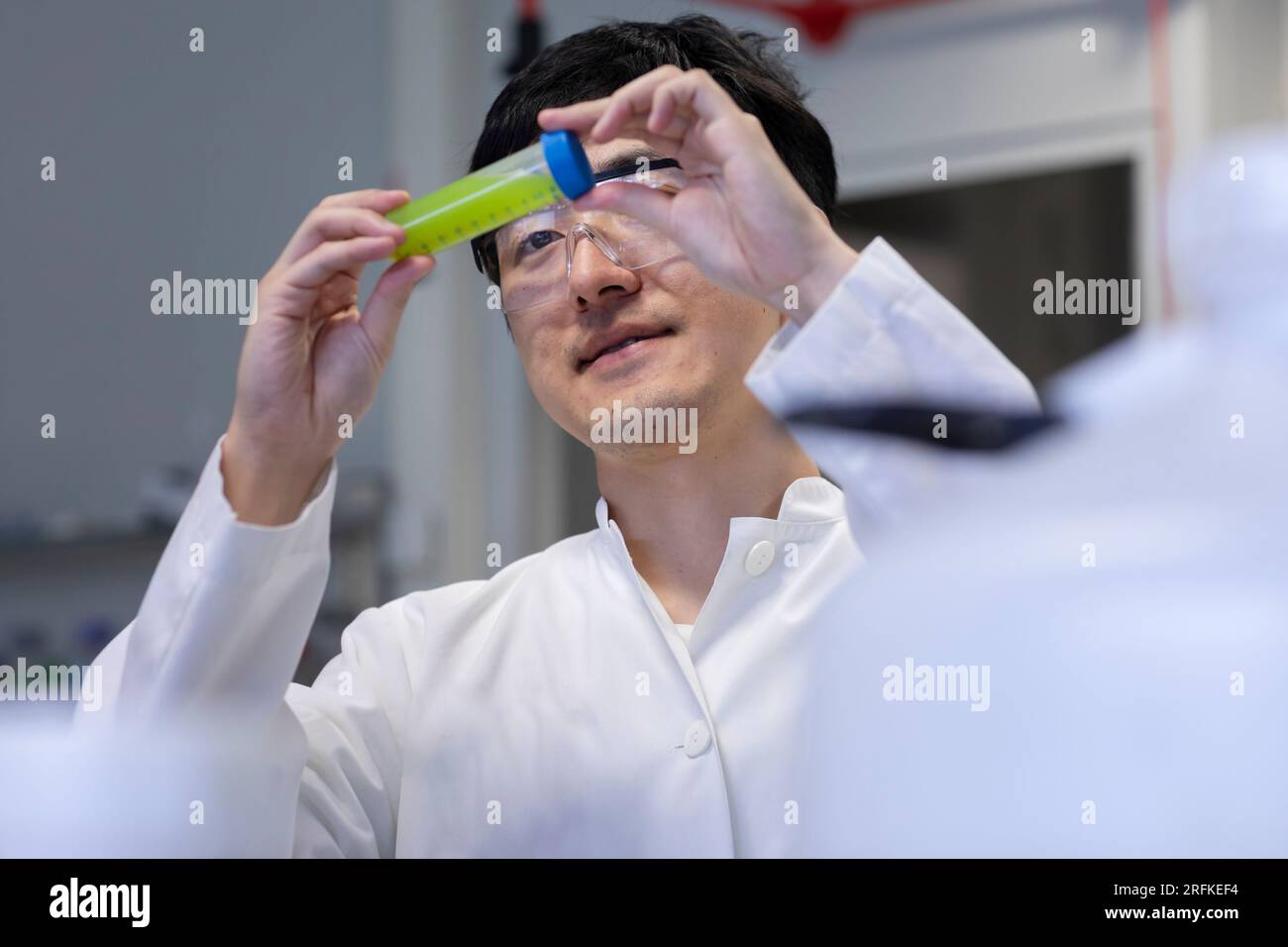 young scientist male chinese working in laboratory Stock Photo - Alamy