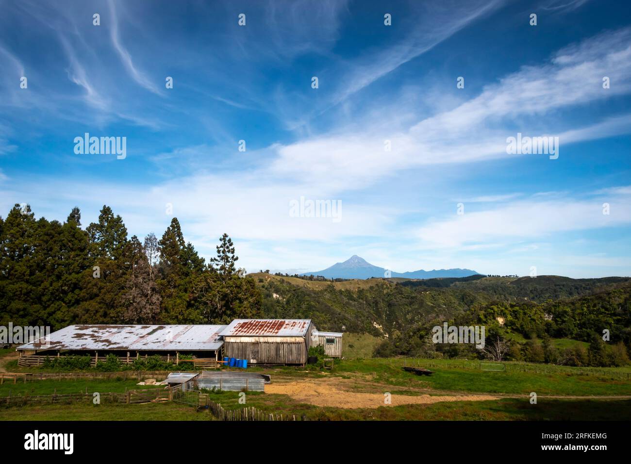 Streaky cloud in blue sky over rural landscape, Taranaki, North Island ...