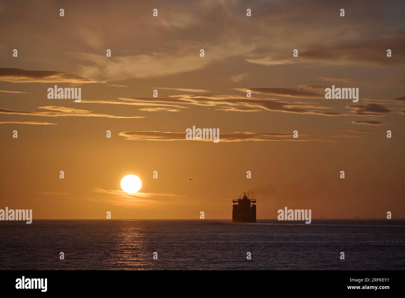 Amazing sunset view with orange colors and sailing cruise ship Stock ...