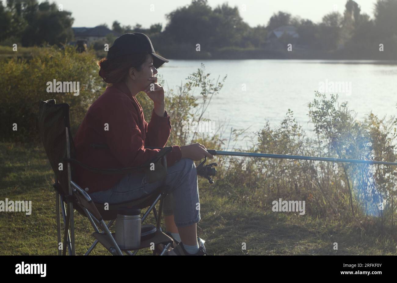 Young asian woman holding fishing hi-res stock photography and images ...