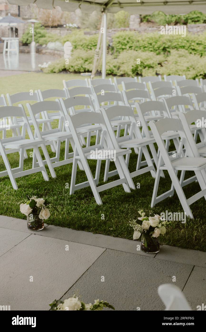 White Chairs aligned for wedding guests to sit for ceremony Stock Photo ...