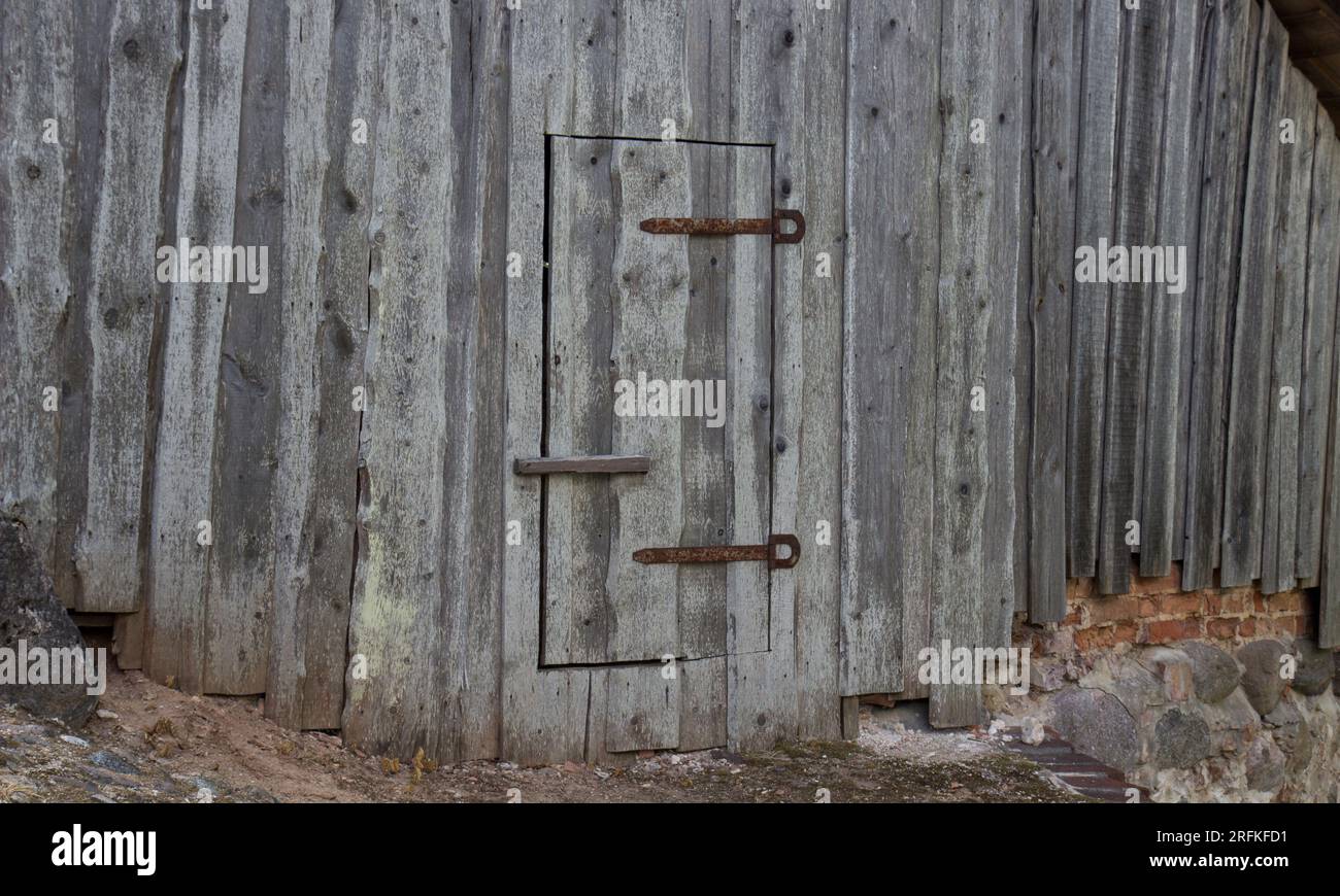 Old rusty hinge on a wooden door. Old rustic background Stock Photo - Alamy