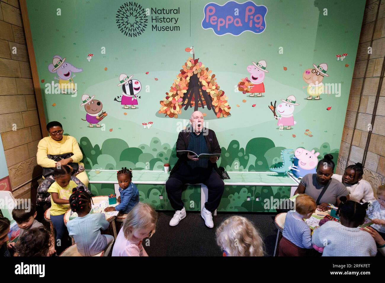 EDITORIAL USE ONLY Actor Richard Ridings reads stories to children at ...