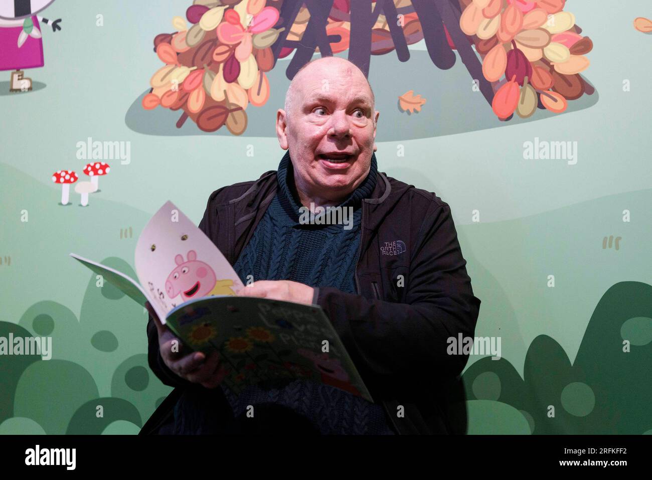 EDITORIAL USE ONLY Actor Richard Ridings reads stories to children at ...