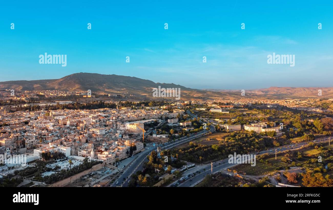 Aerial drone view of Fes at sunset, Morocco. Multiple residential ...