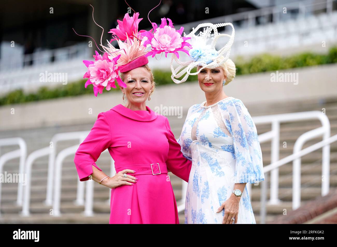 Racegoers Viv Jenner (left) and Rachel Oates pose for photographs ...