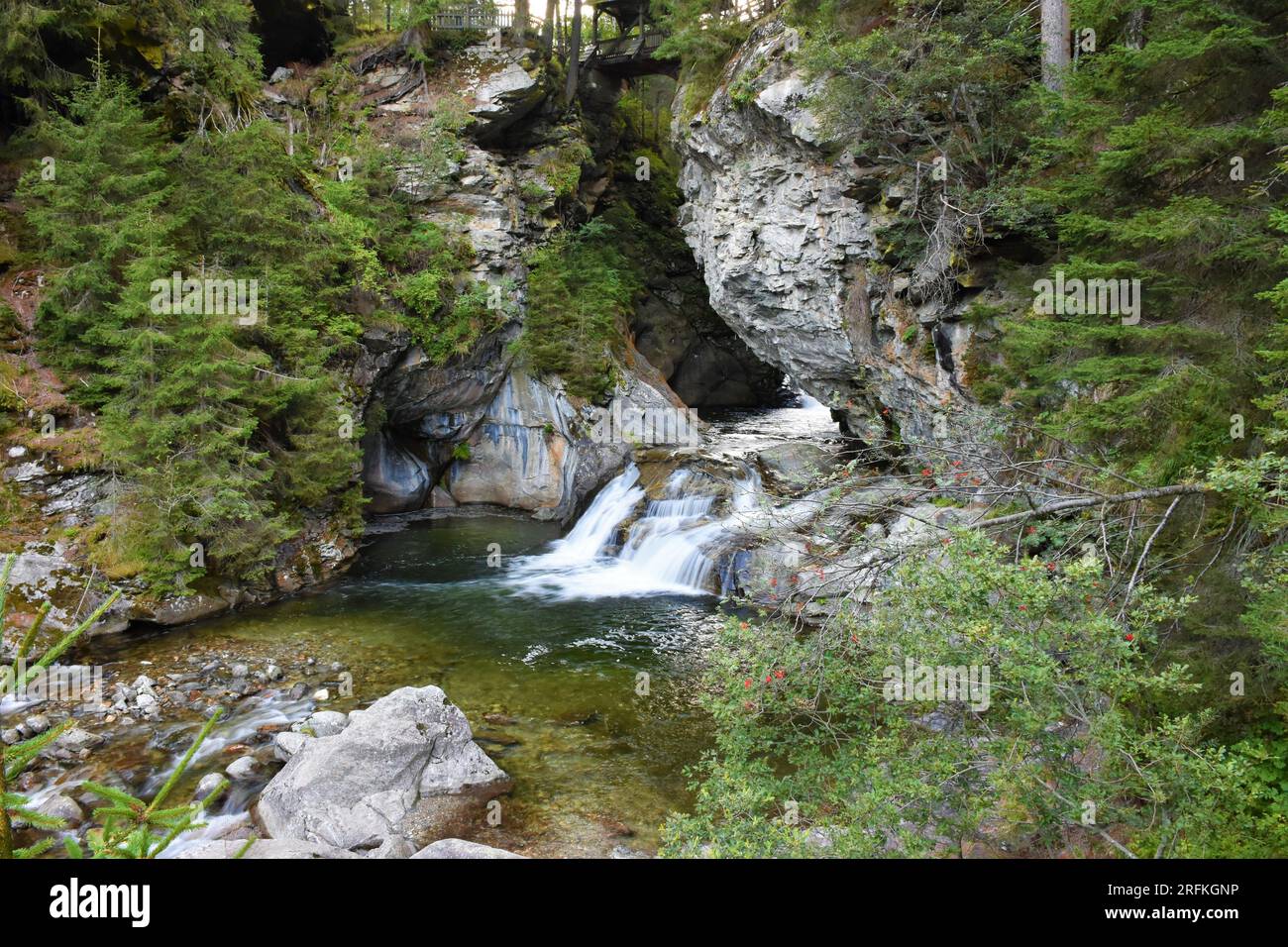 Water flowing into a small waterfall from a gorge at Malta ...