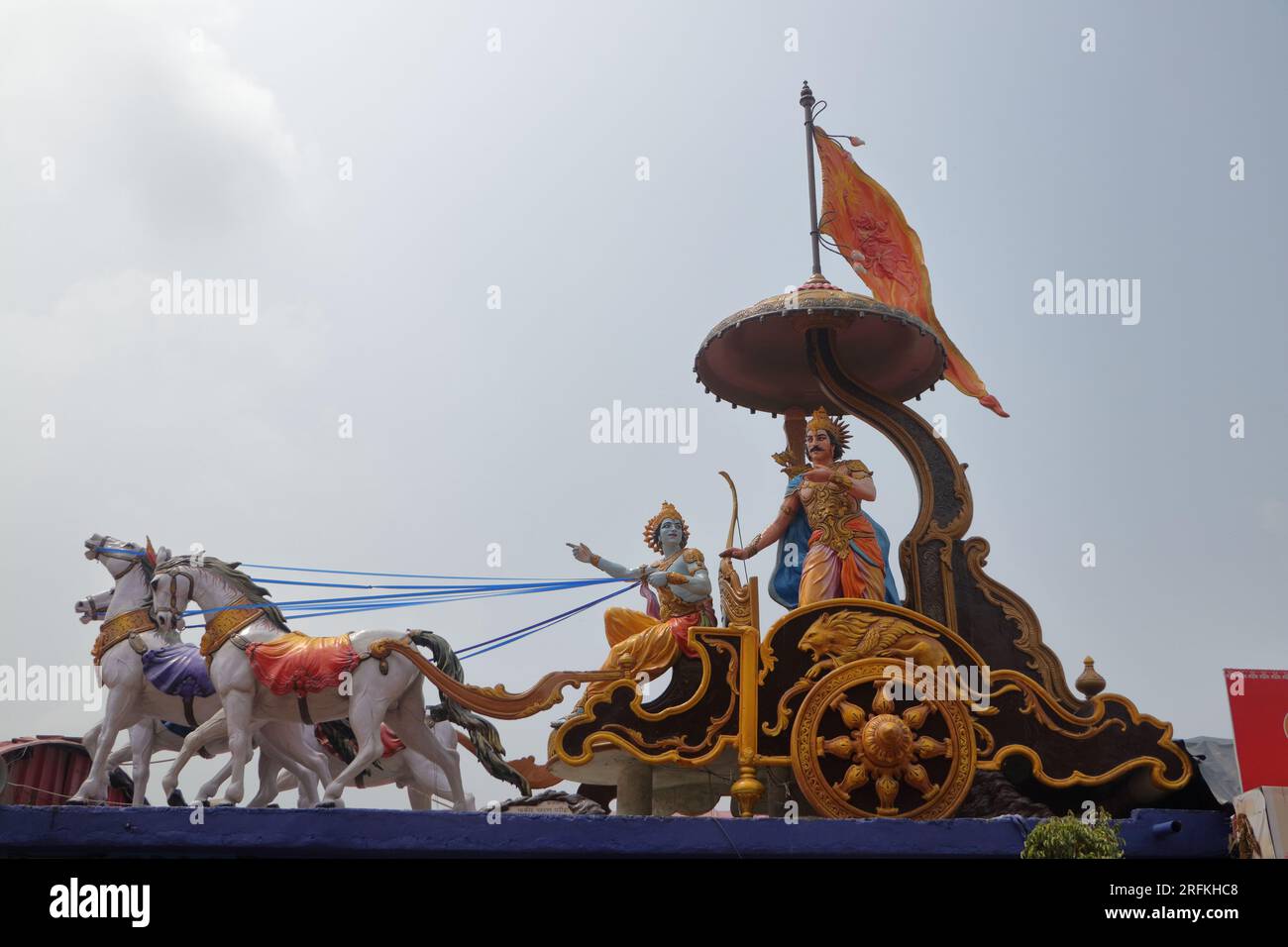 A beautifully colored sculpture showing Shri Krishna as a charioteer ...