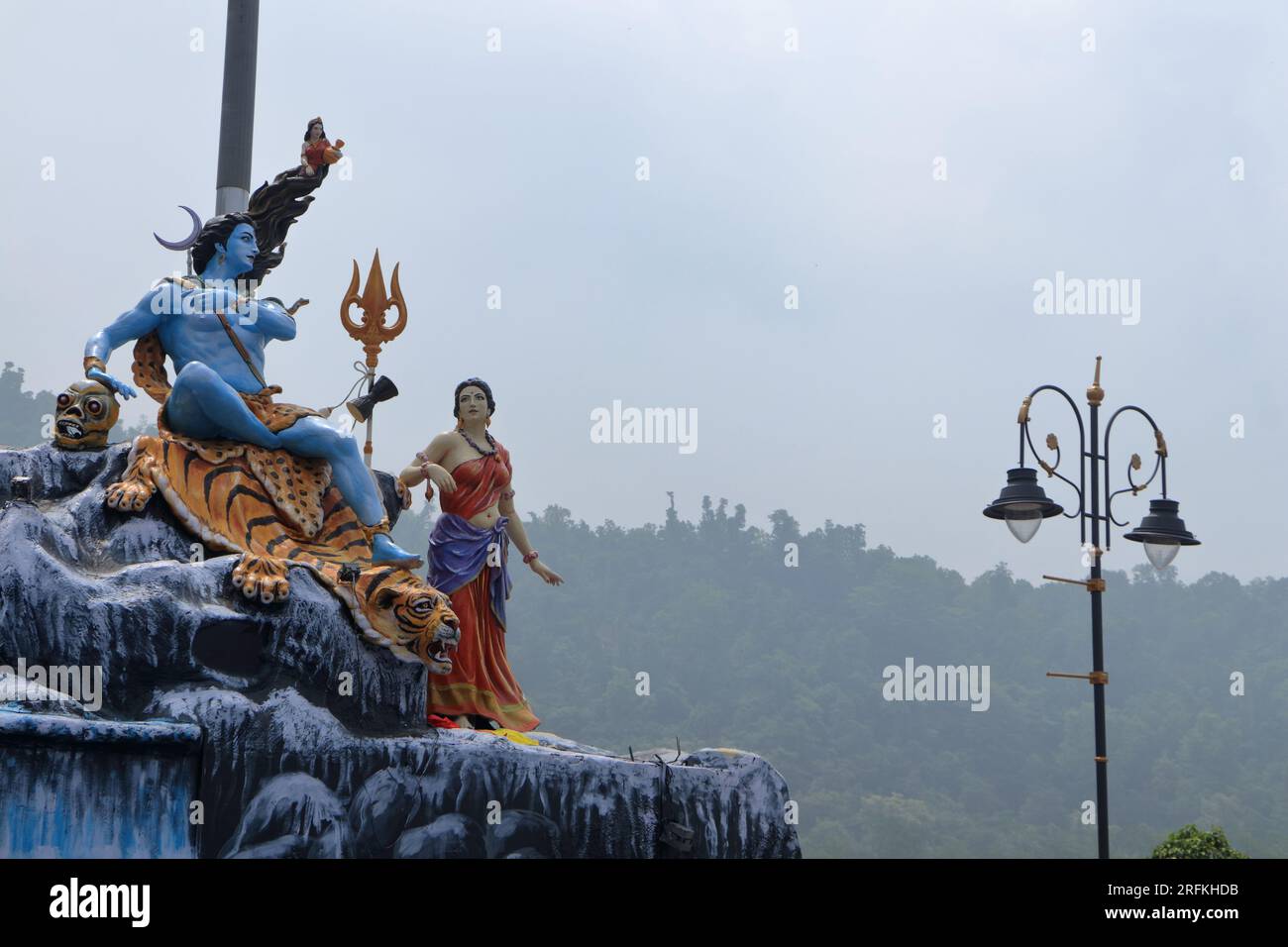 Giant statue of Lord Shiva and Parvati at Triveni Ghat, Rishikesh, with ...