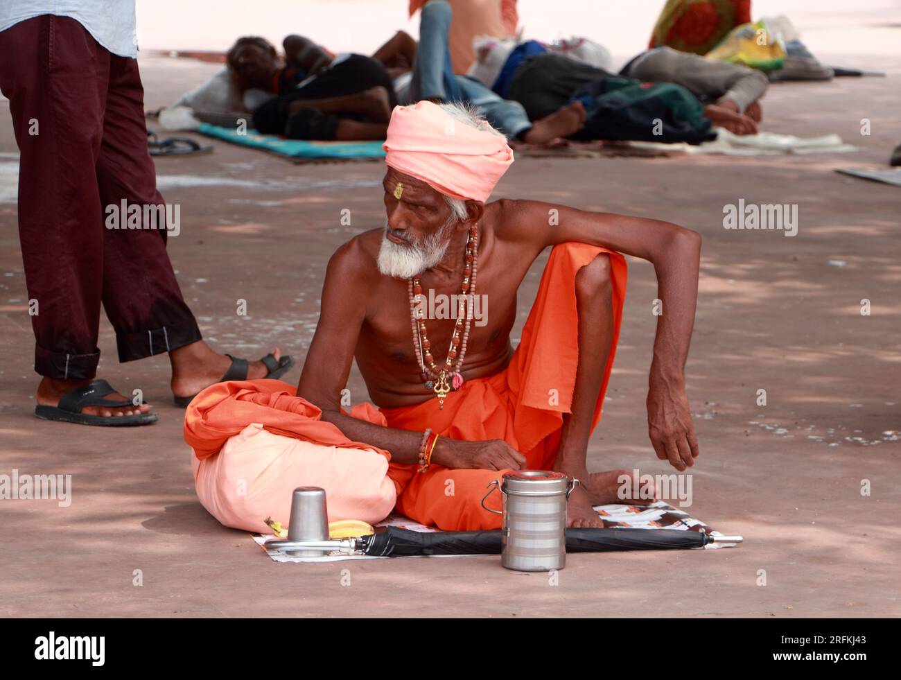 A monk sitting at the Triveni Ghat in Rishikesh Stock Photo - Alamy